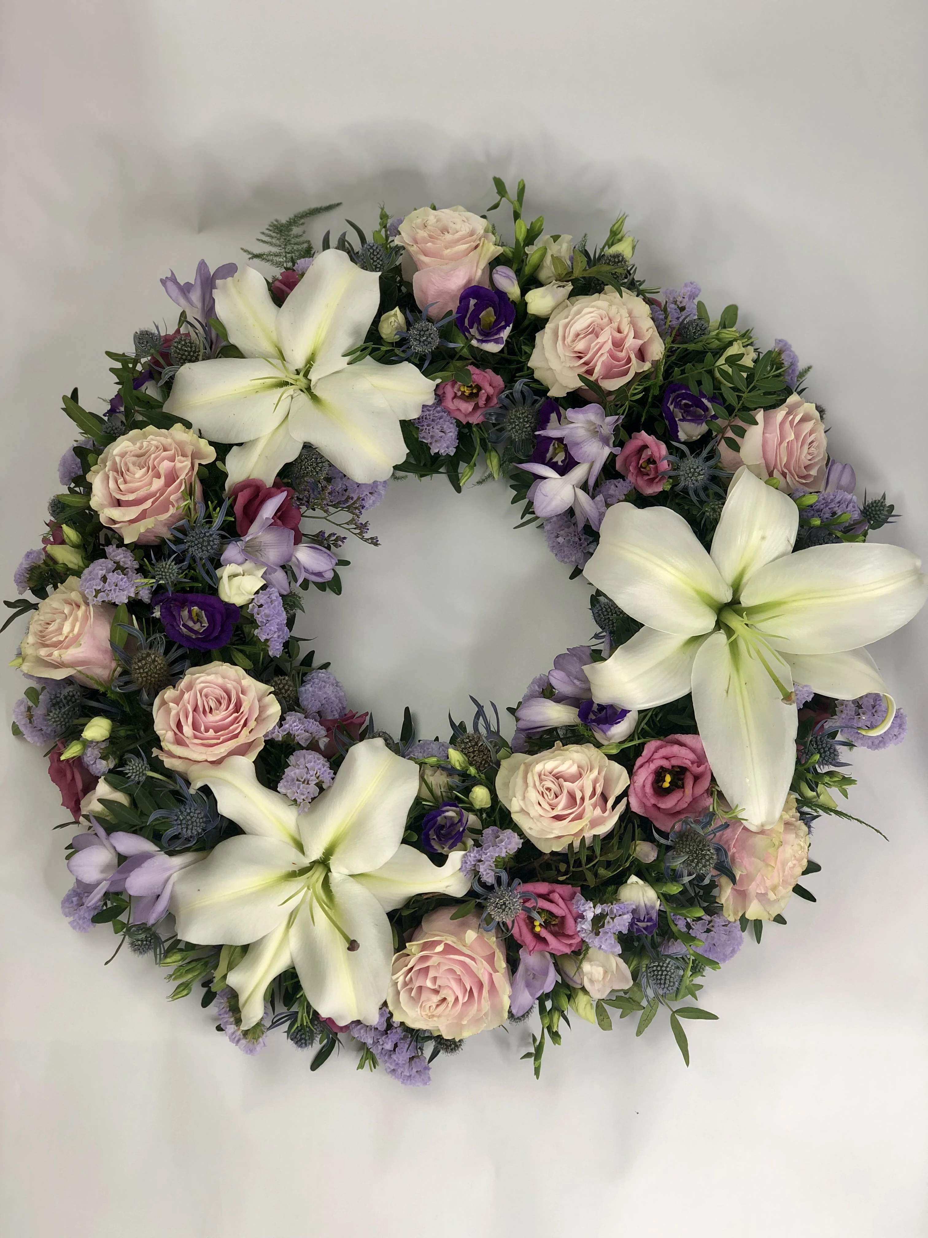 Rose and Lily Wreath Pink and Lilac Local Liverpool Florist shop offering Same Day Flower Delivery Order your Flowers online on the phone or in store for flower delivery today
